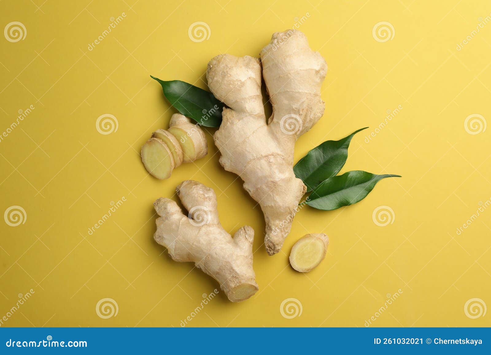 Fresh Ginger with Green Leaves on Pale Light Yellow Background, Flat ...