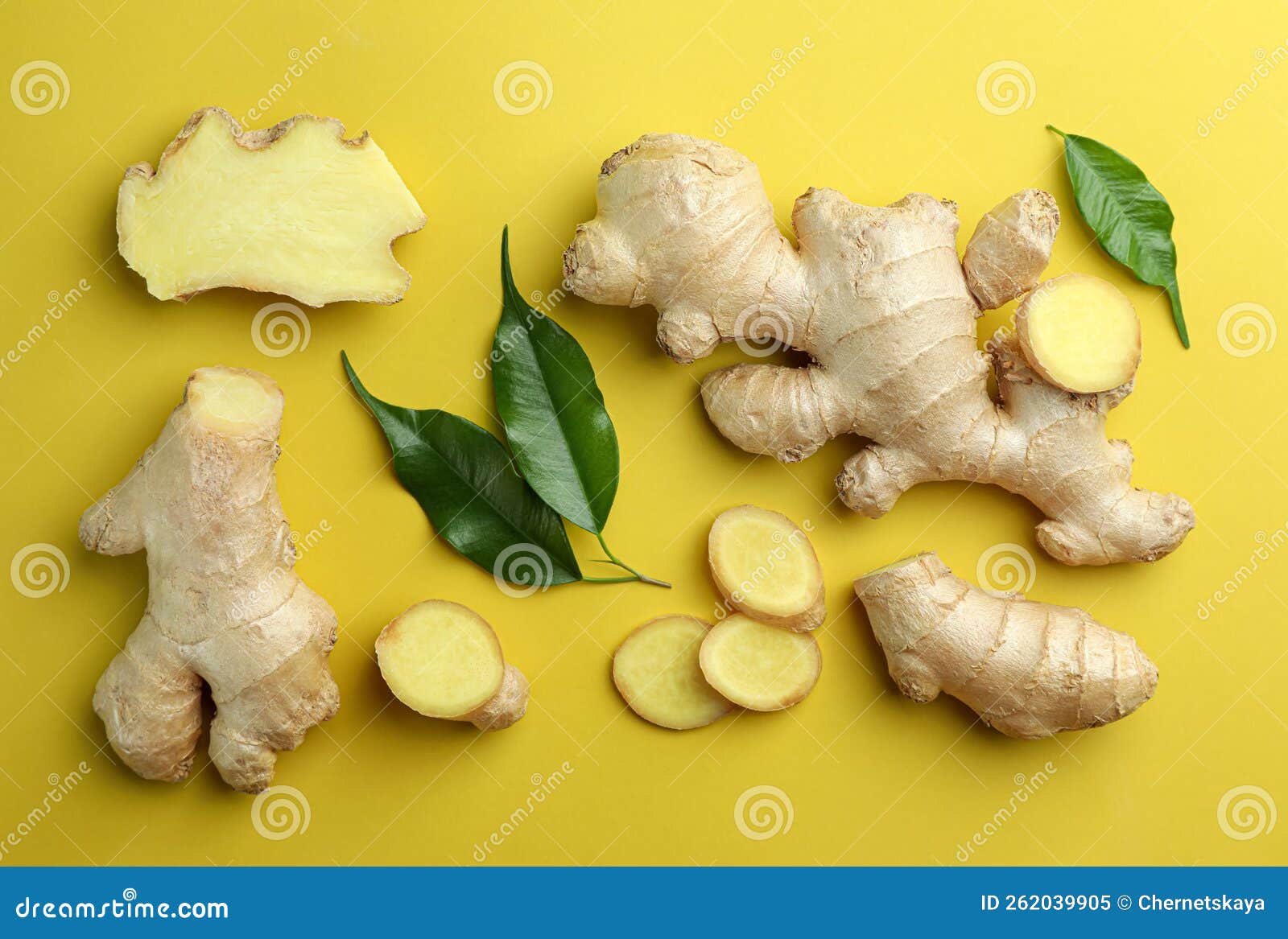 Fresh Ginger with Green Leaves on Pale Light Yellow Background, Flat ...
