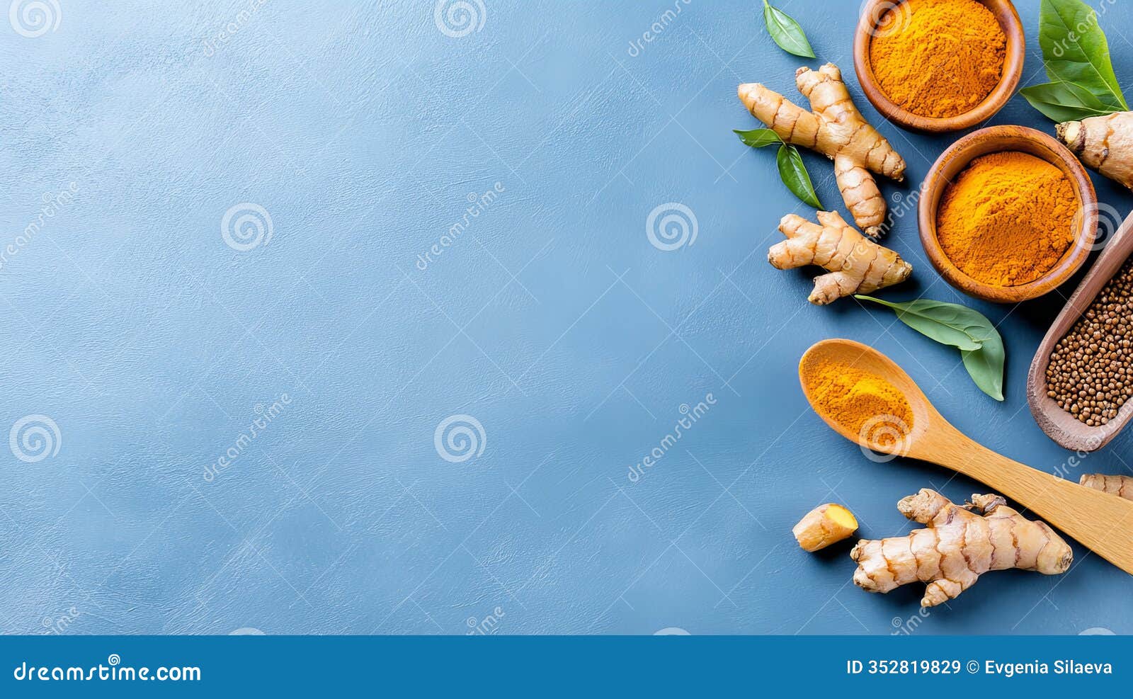 Fresh Ginger Roots and Ground Turmeric on Blue Background Stock ...