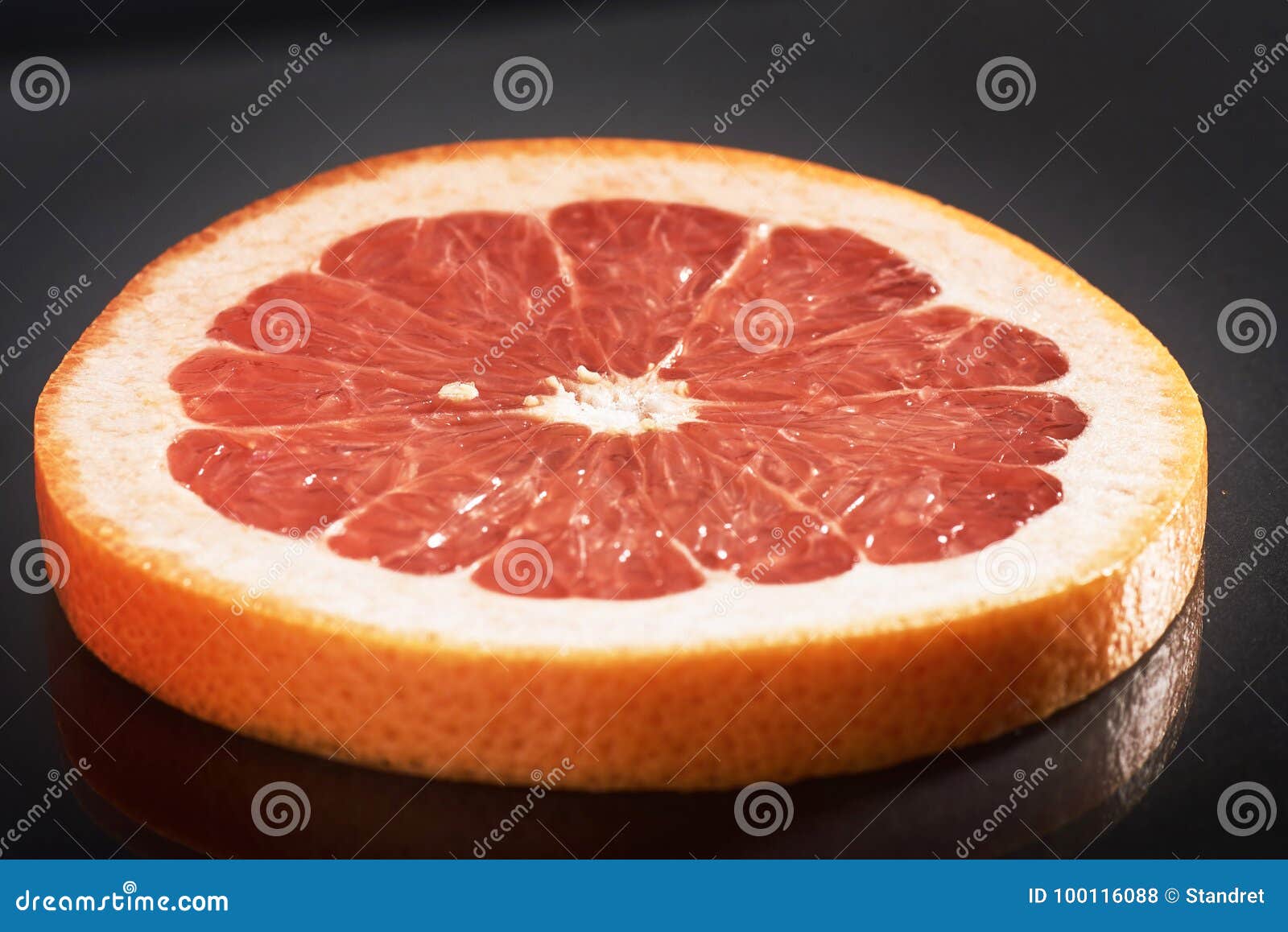 Fresh Grapefruit Pieces. on Black Background. Stock Photo - Image of ...