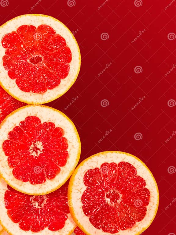Fresh Grapefruit Slices Isolated on a Gradient Red Stock Image - Image ...