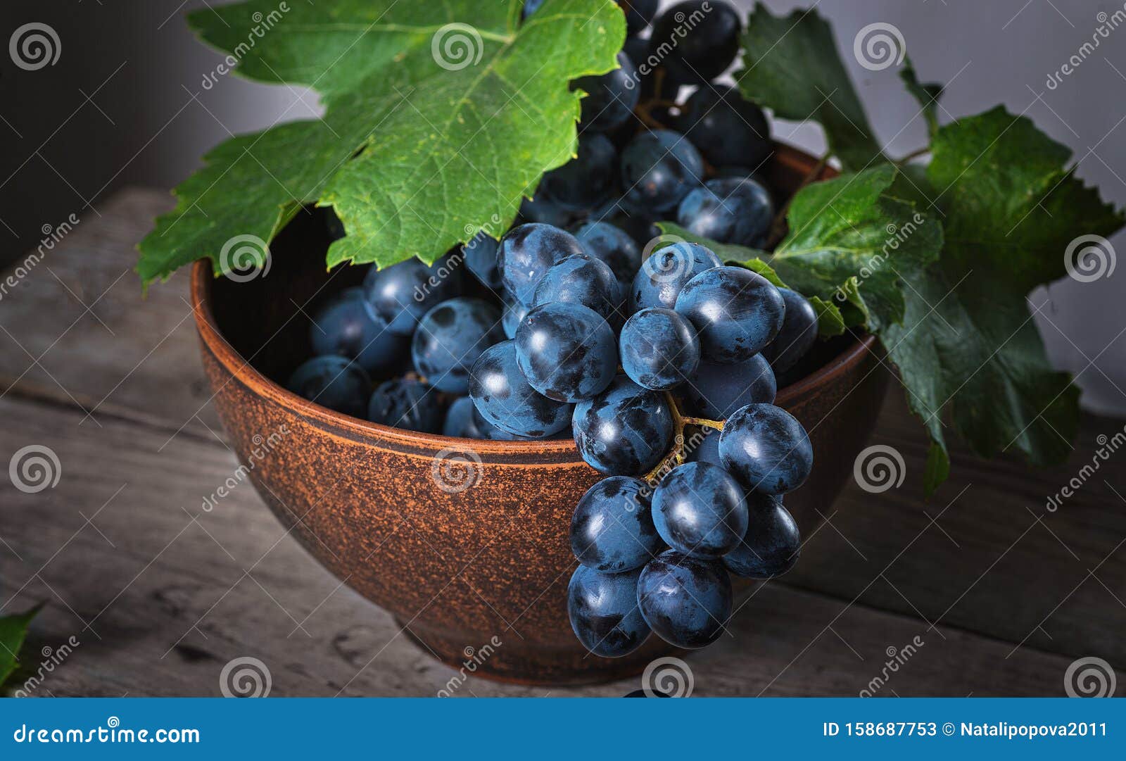 Fresh Grapes in a Clay Plate on a Wooden Old Table Stock Image - Image ...