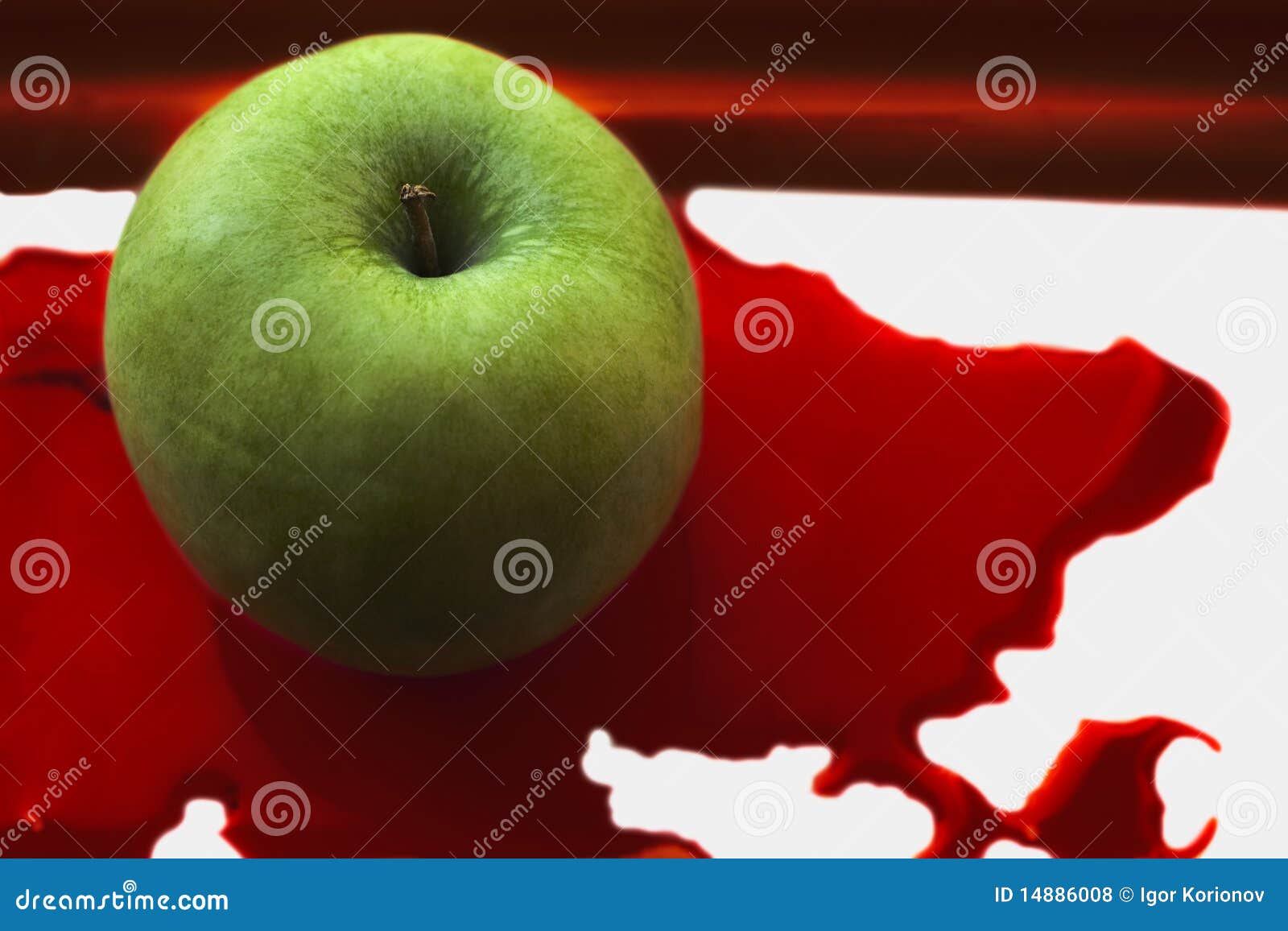Fresh Green Apple in a Pool of Red Blood Stock Photo - Image of white ...
