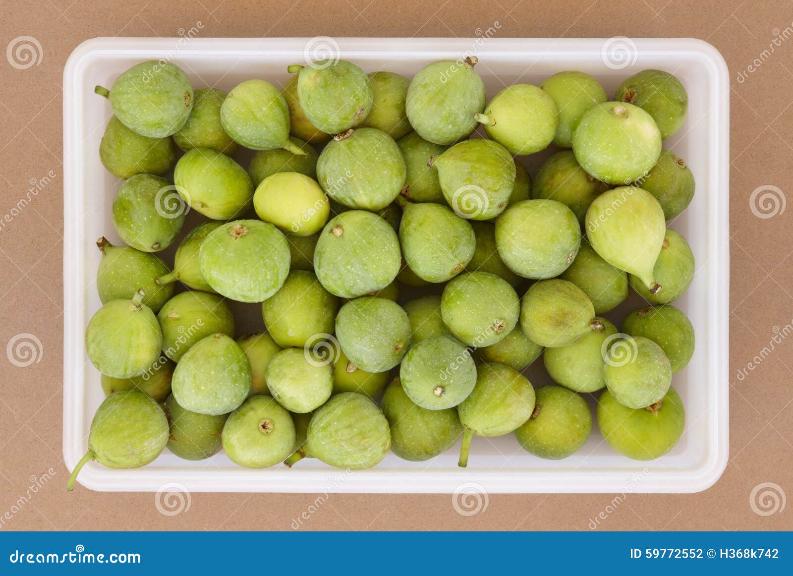 Fresh Green Figs on a Plastic Container Viewed from Above Stock Photo ...