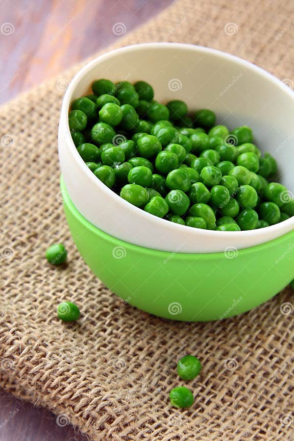 Fresh green peas in a cup stock photo. Image of fruit - 18140724