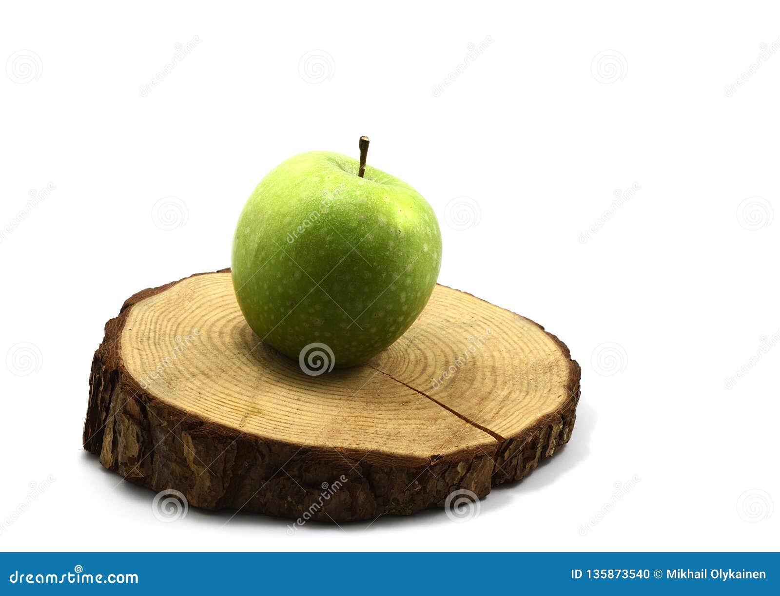 Fresh Green Spotted Apple and Wooden Circle Stock Photo - Image of ...