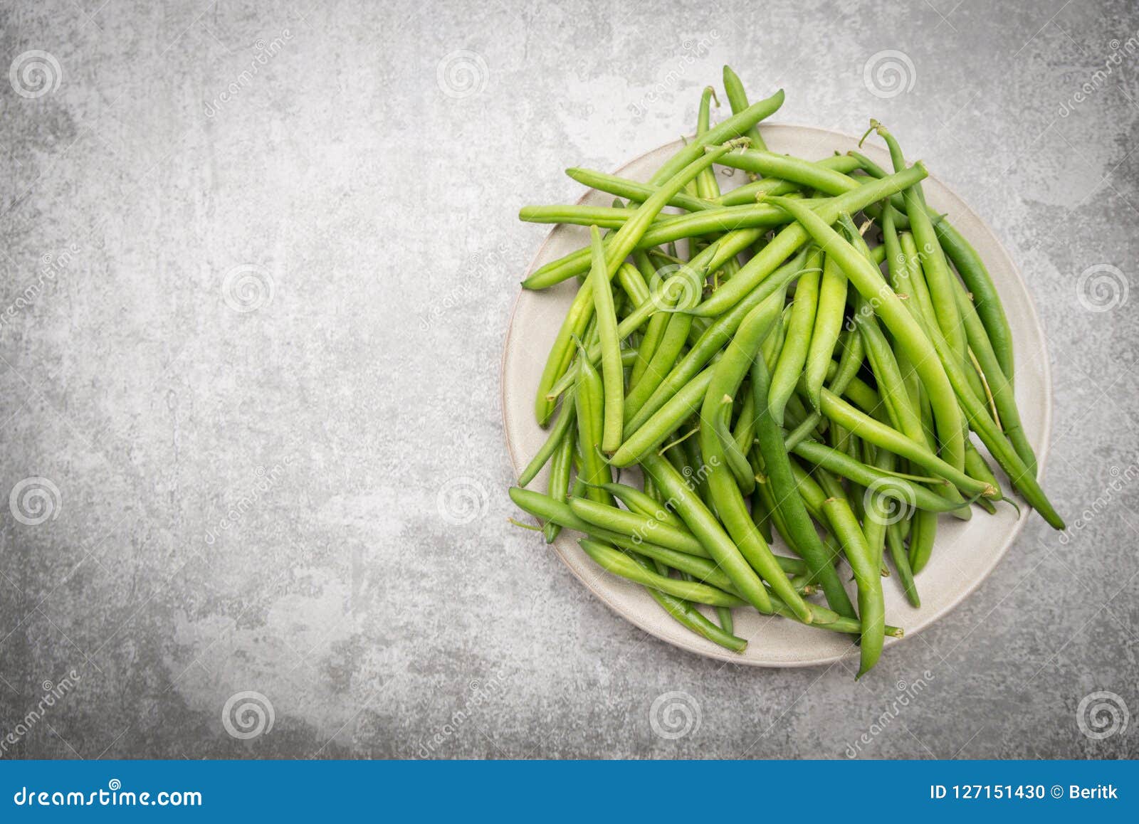 Fresh Green String Beans on a Plate Isolated on a Grey Structured ...