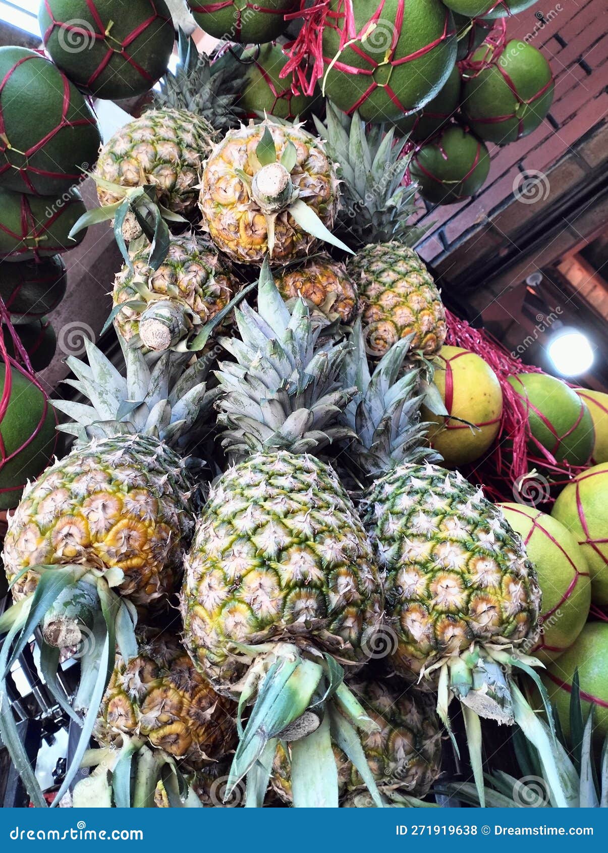 Fresh Hanging Pineapple for Display Stock Photo - Image of city, market ...