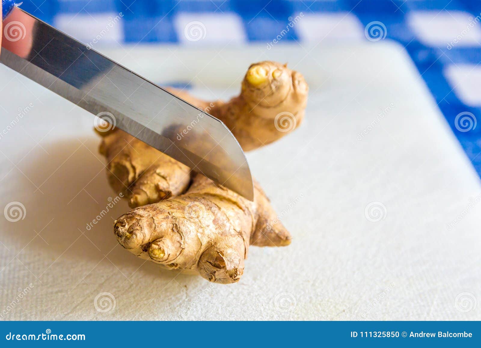 Fresh Healthy Ginger Root Being Sliced into Pieces Stock Photo - Image ...