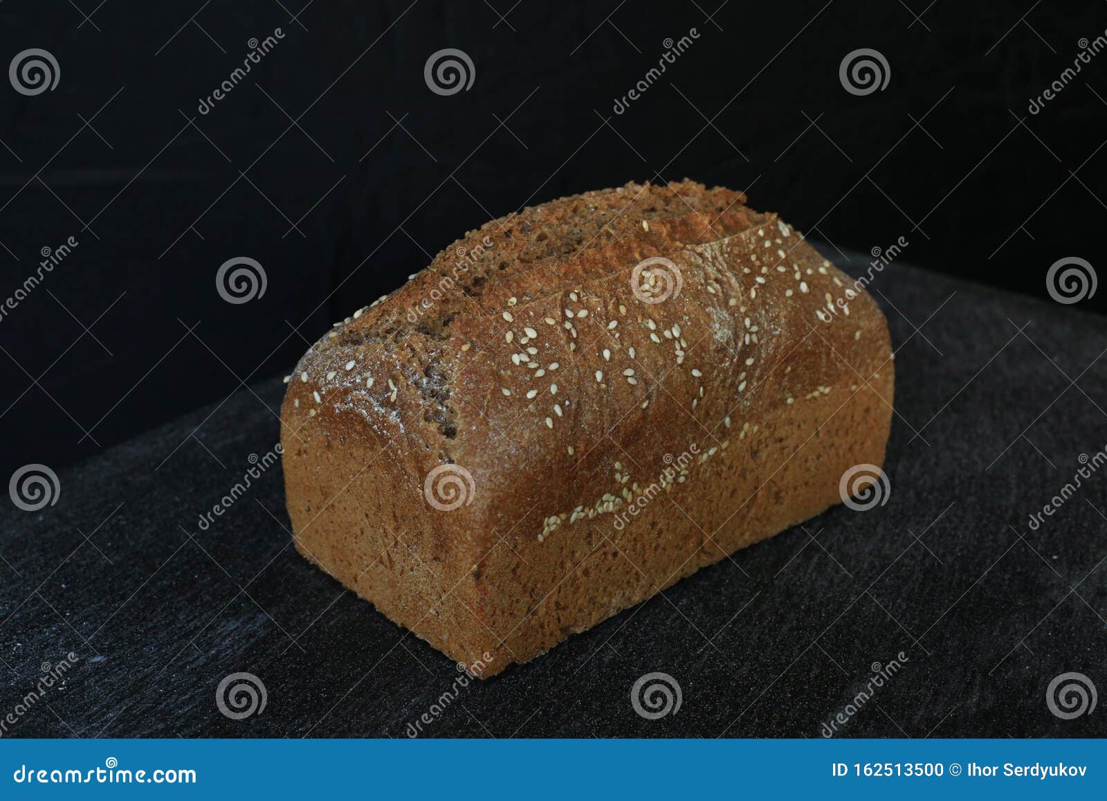 Fresh Homemade Rectangular Bread on a Dark Background. Mother Dough ...
