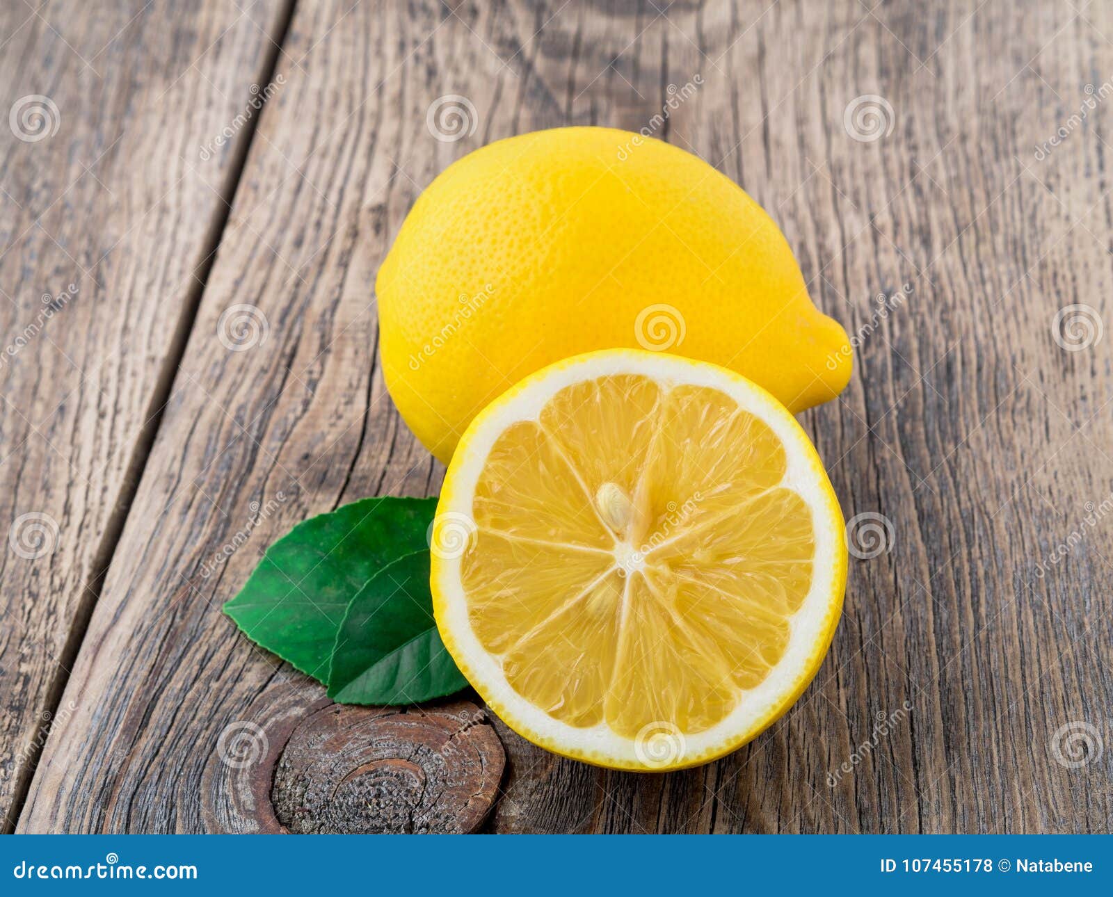 Fresh Lemon and Cut Off Half on Wooden Old Table, Side View Stock Photo ...