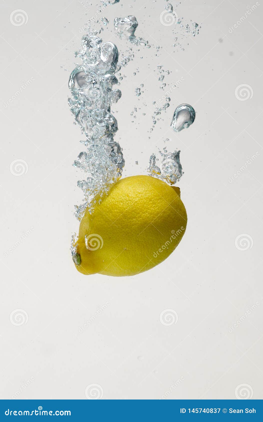 Fresh Lemon Drop on Water with Babble Stock Image - Image of orange ...