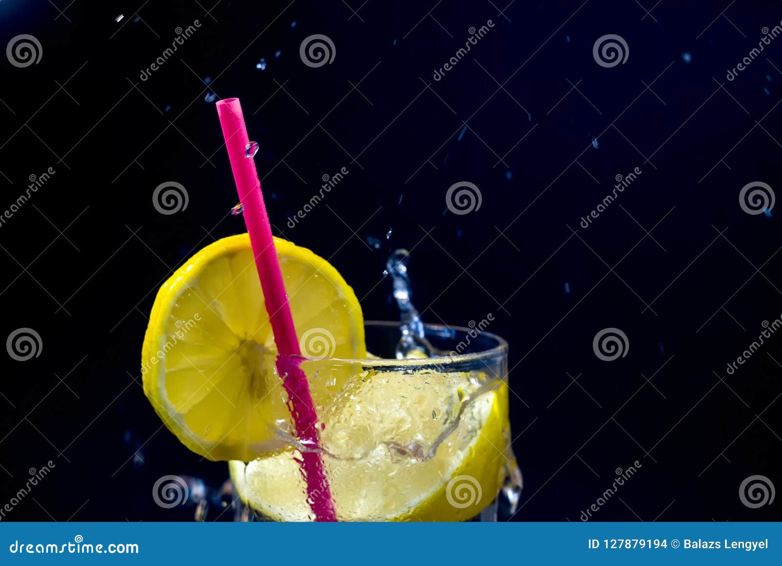 Fresh Lemonade, Lemon and Drinking Straw with Splashing Effect I Stock ...