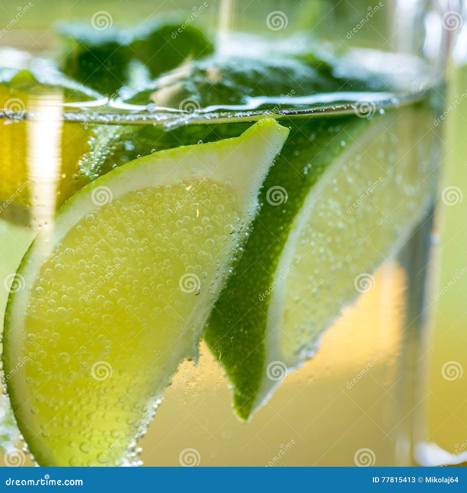 Fresh Lemonade with Slices of Limes in a Glass Pot Stock Image - Image ...
