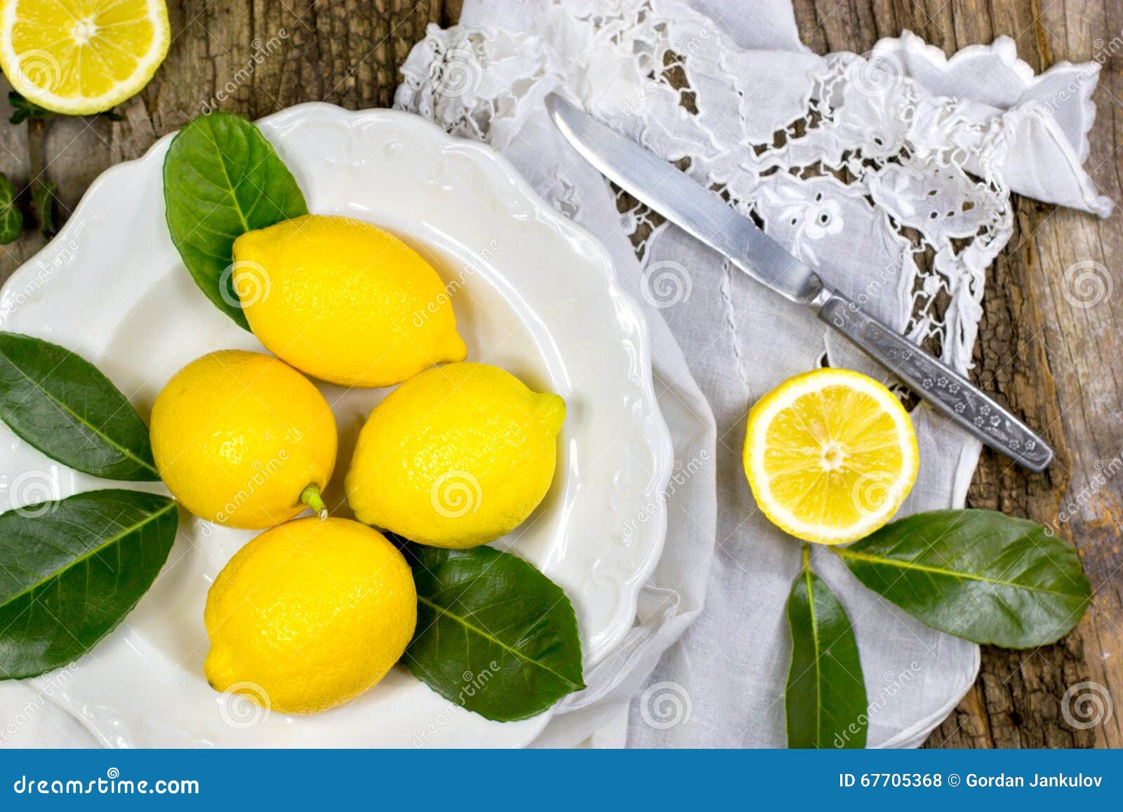 Fresh Lemons on Rustic White Plate Stock Photo - Image of lemon, plate ...