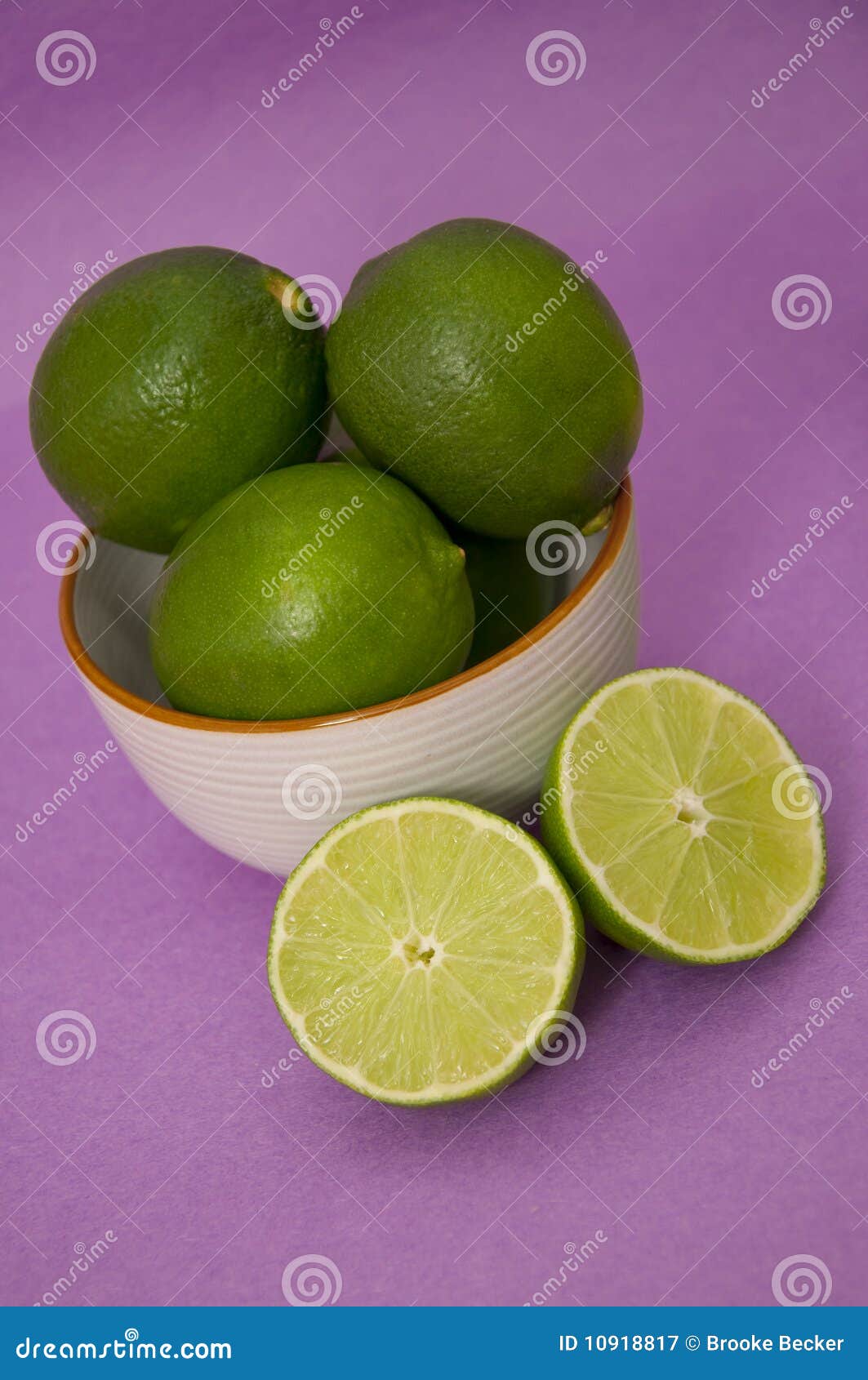 Fresh Limes on Purple stock image. Image of purple, shot - 10918817