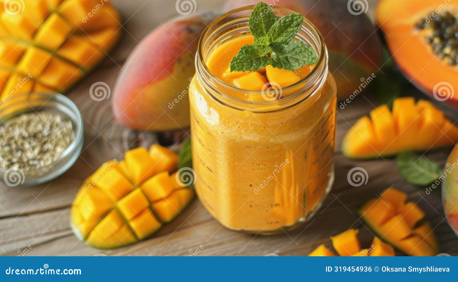 Fresh Mango Smoothie with Mint Garnish on Wooden Table Stock Photo ...