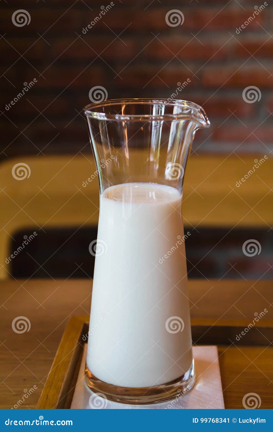 Fresh milk on wooden table stock image. Image of nutrition - 99768341