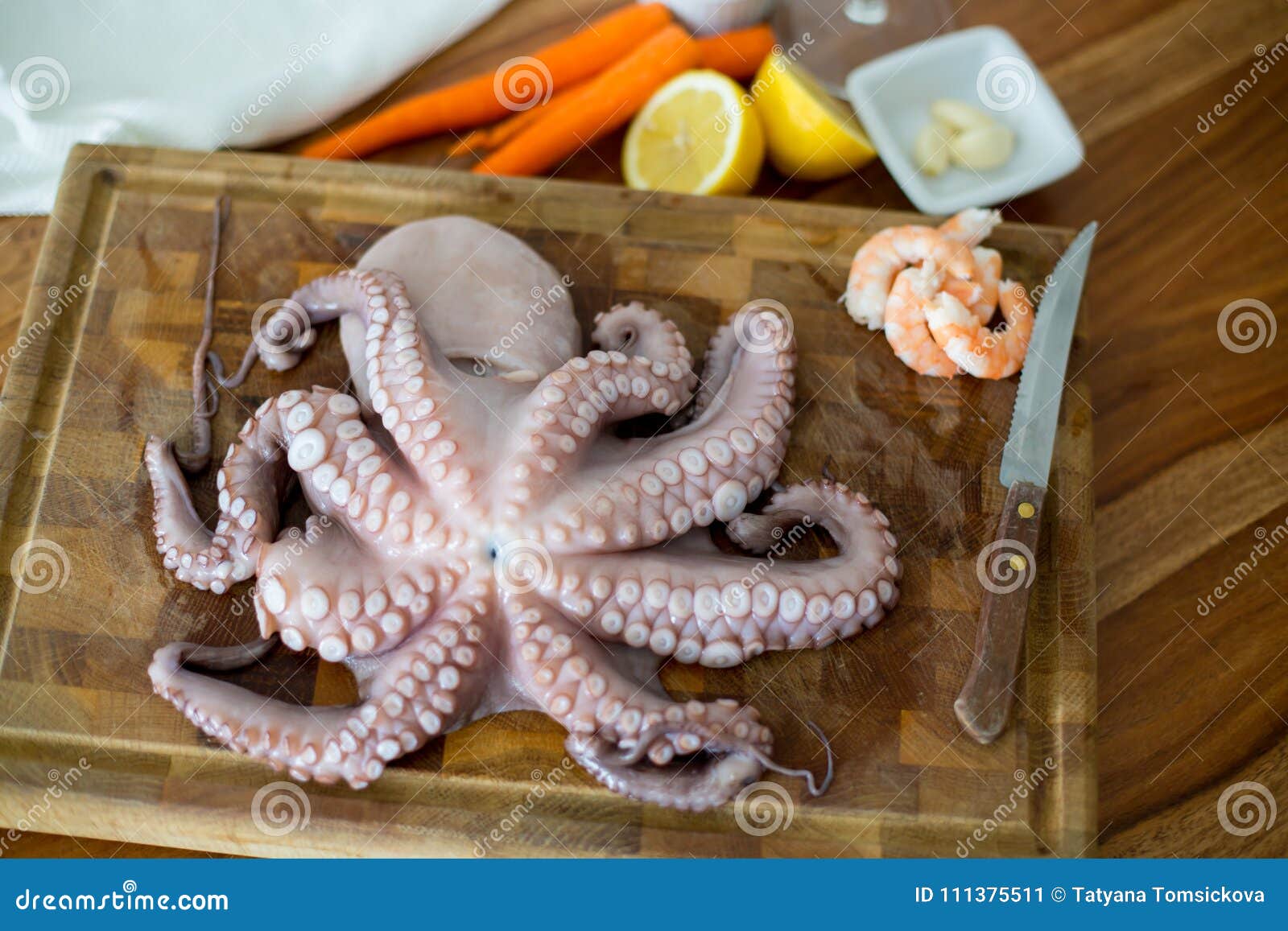Fresh Octopus on Chopping Board with Lemon,white Wine and Pepper Stock ...