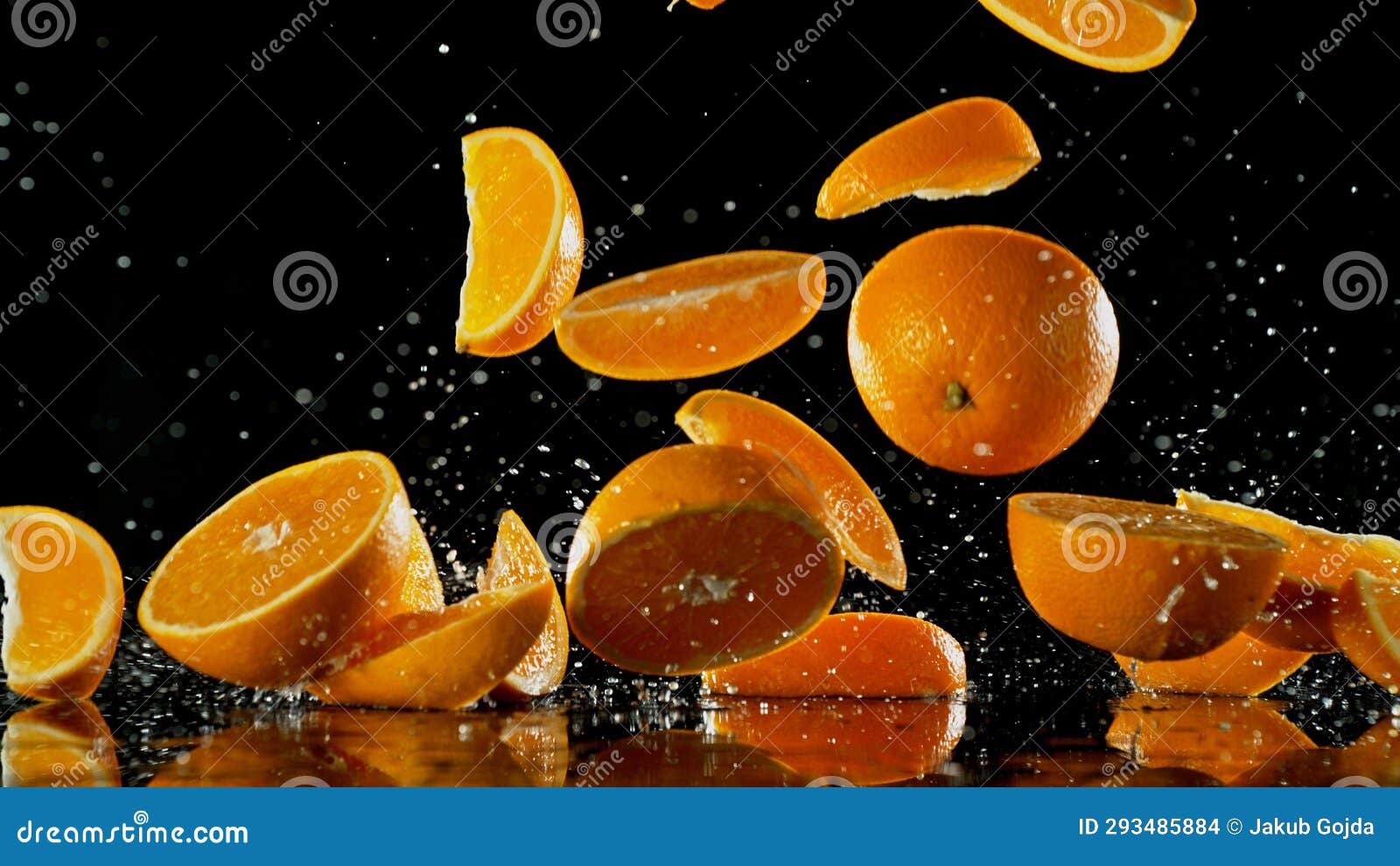 Fresh Orange Slices Falling Down on Black Background Stock Photo ...