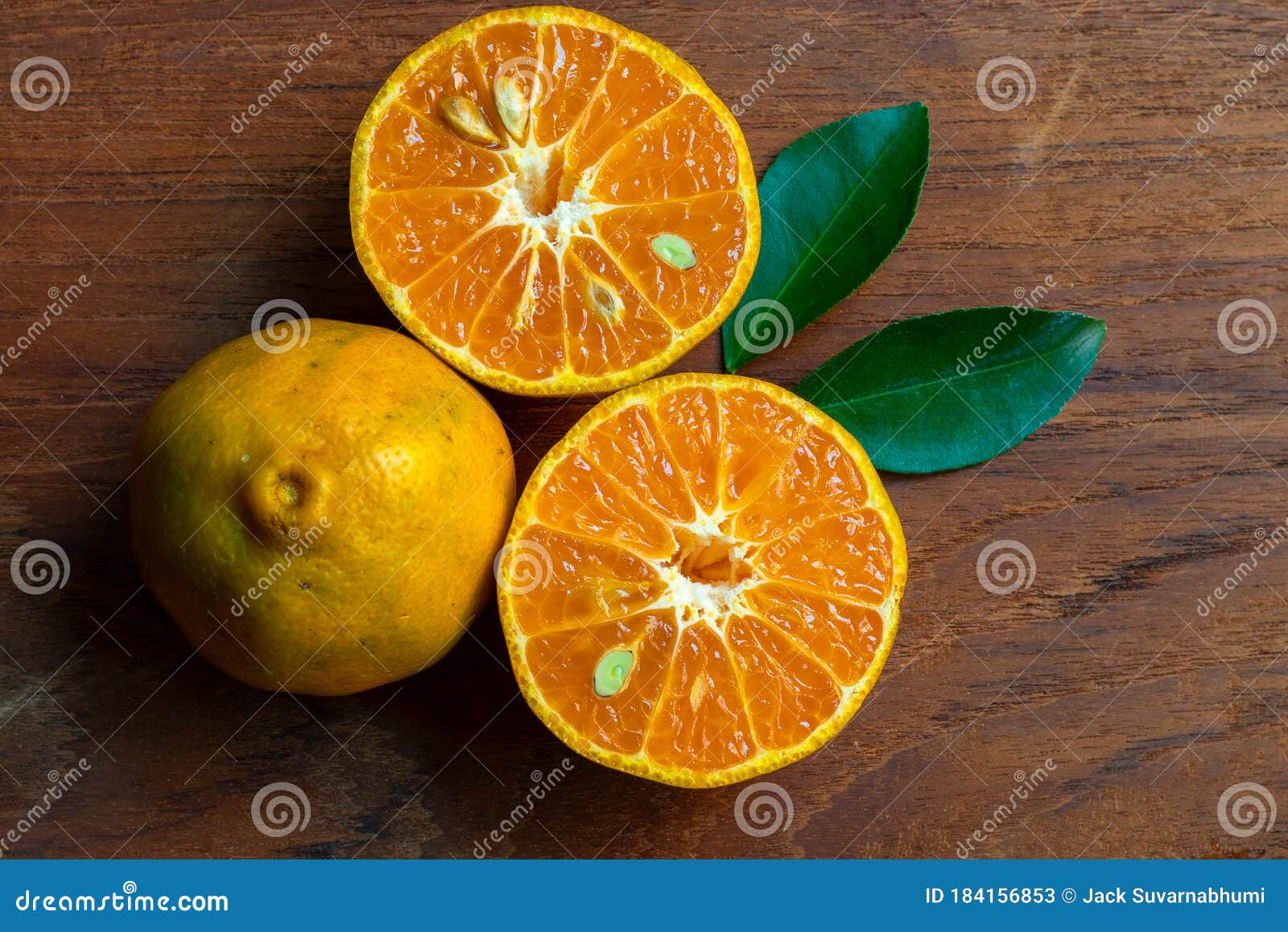 Fresh Oranges with Green Leaves on a Wooden Table Stock Image - Image ...