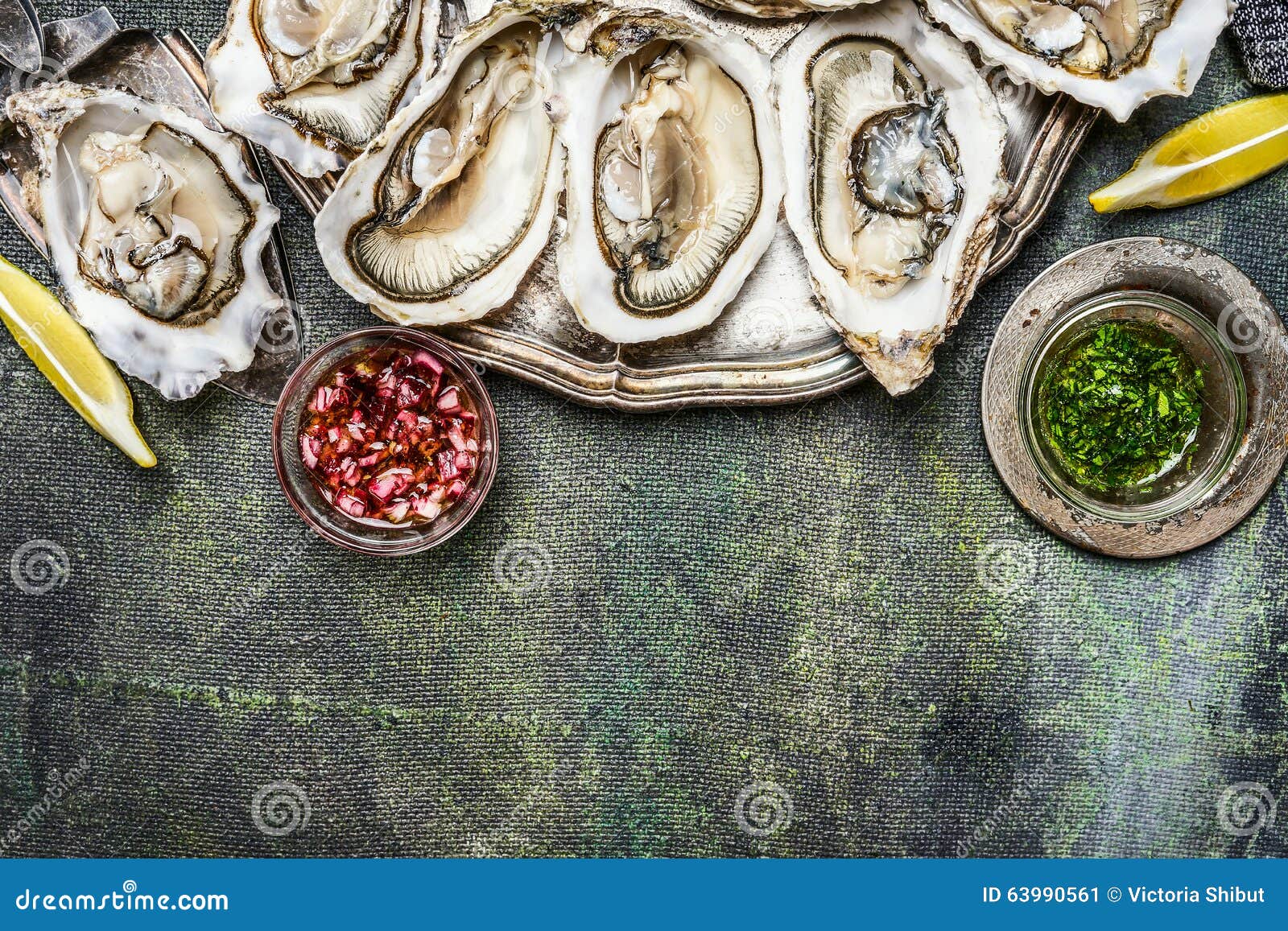 Fresh Oysters with Lemon and Various Sauces on Rustic Background, Top ...