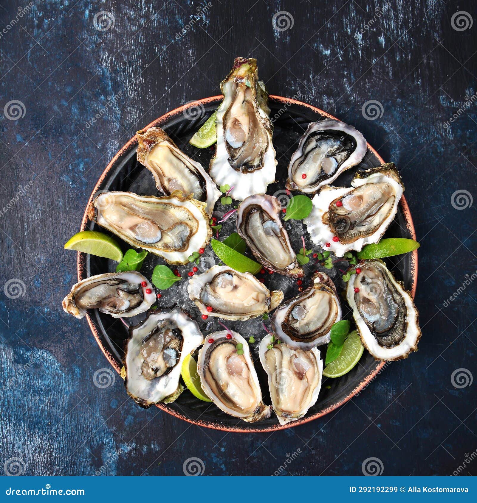 Fresh Oysters with Lime on Round Plate. Several Varieties of Oysters ...