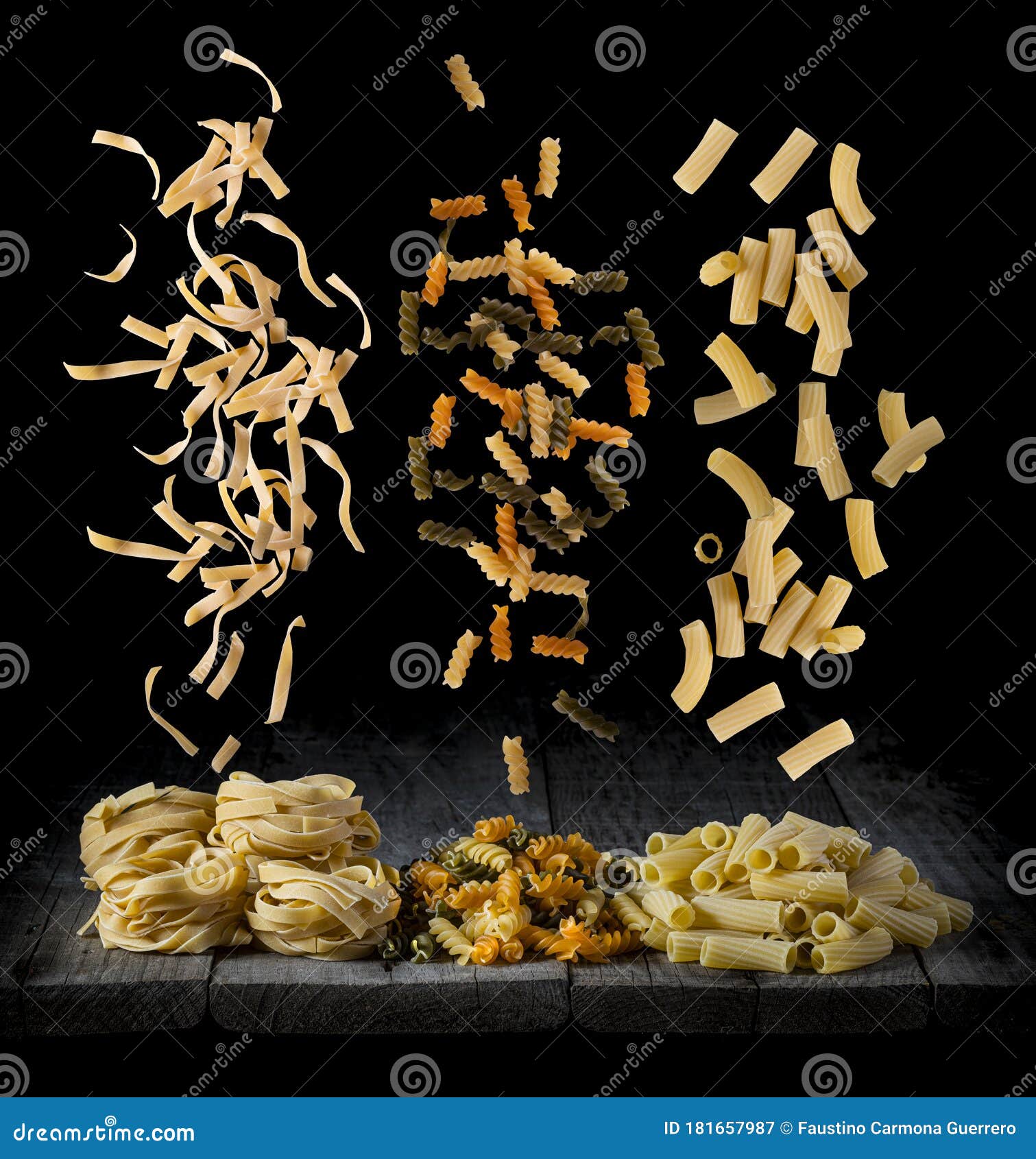 Fresh Pasta Falling in Different Shapes and Colours on a Wood in Front ...