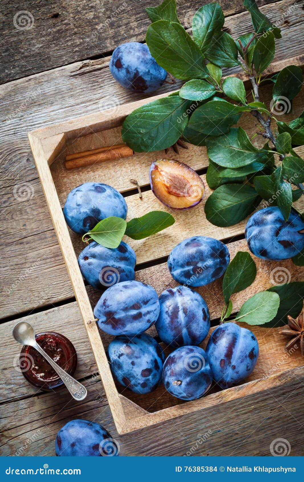 Fresh Plums in Wooden Box and Jar of Fruit Jam. Top View. Stock Photo ...