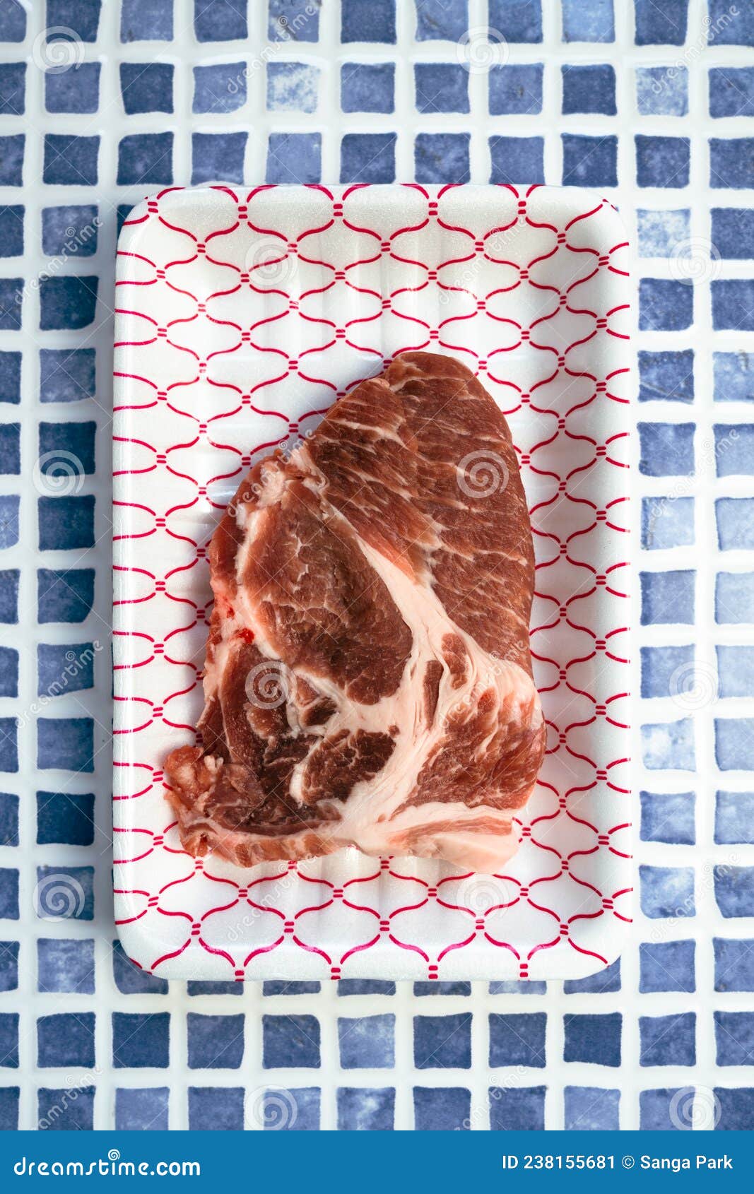 Fresh Pork Neck Meat in Packaging Tray on Blue Tile Table Stock Image ...