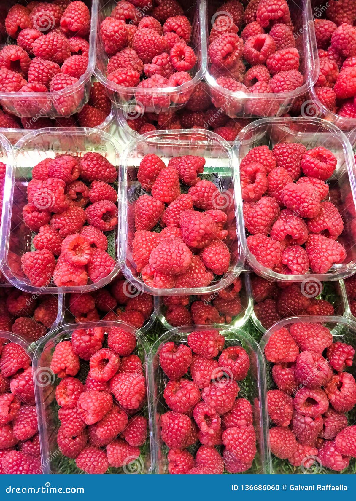 Fresh Raspberries in Many Plastic Boxes on Display at the Market Stock ...