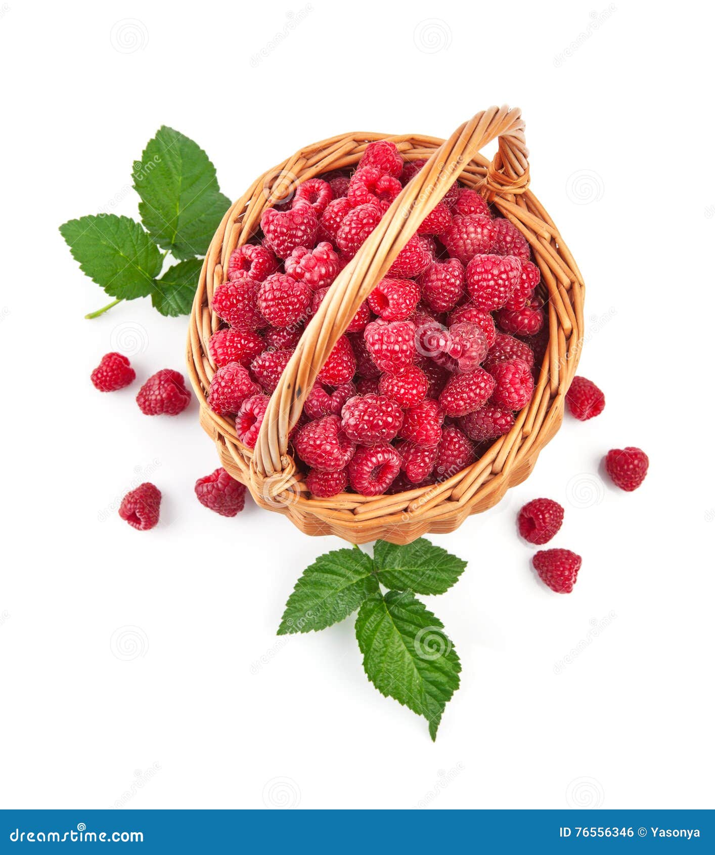 Fresh Raspberries in Wicker Basket with Green Leaves Stock Photo ...