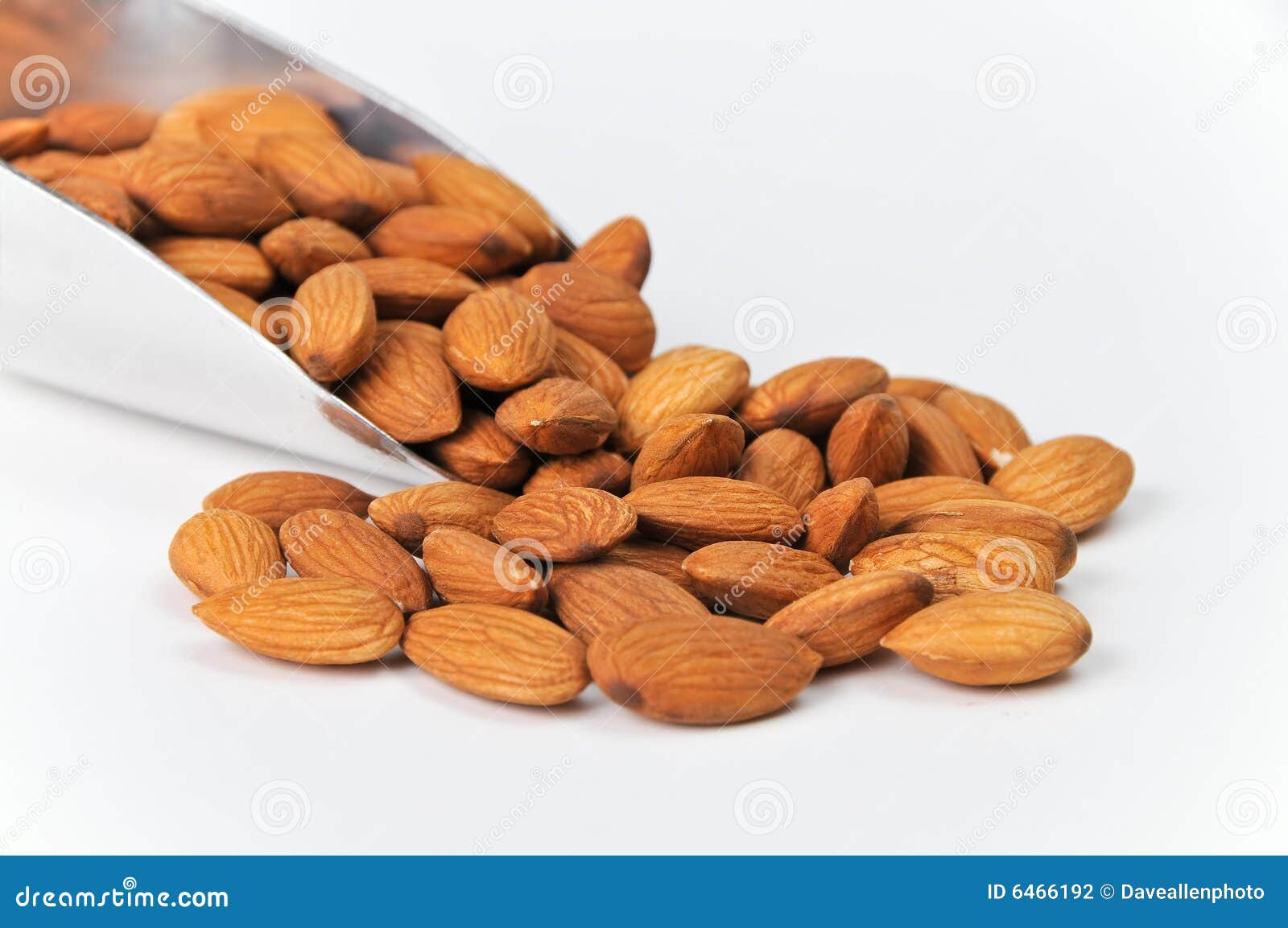 Fresh Raw Almonds in Aluminum Scoop on White Stock Photo - Image of ...