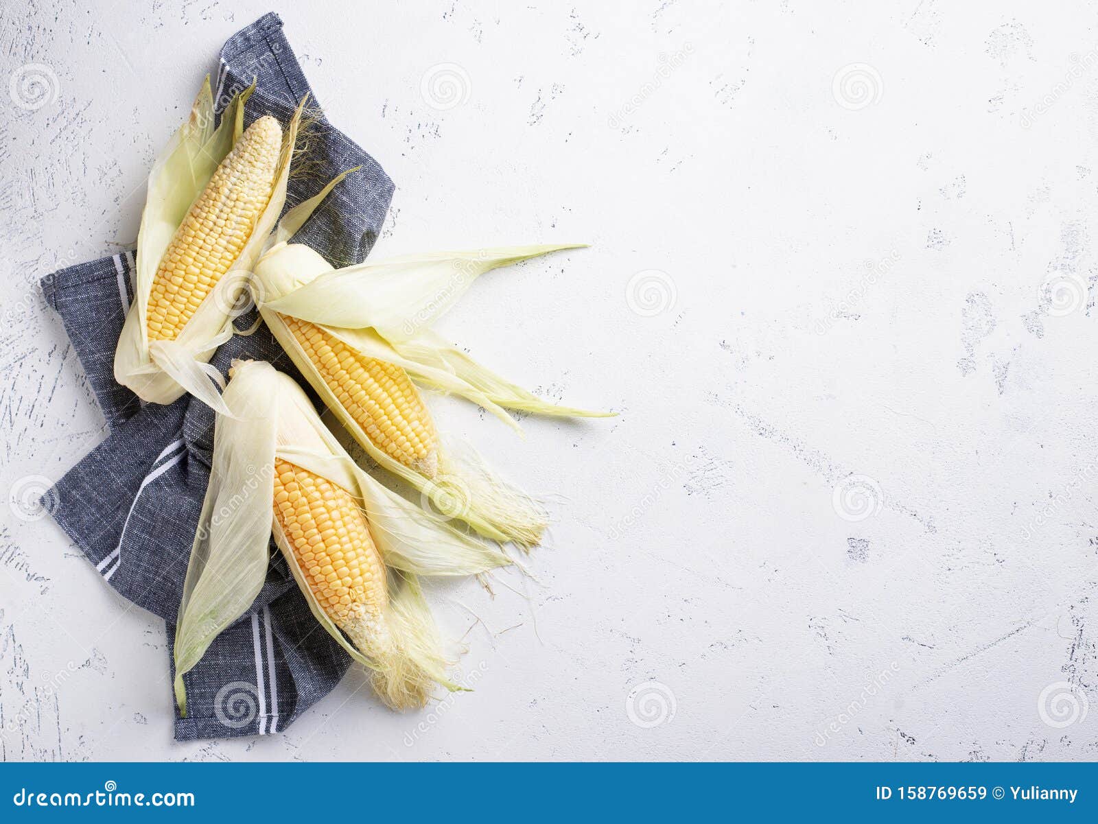 Raw corn on concrete table stock image. Image of natural - 158769659
