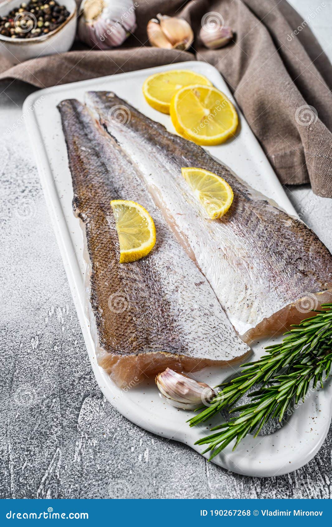 Fresh Raw Hake Fish Fillet with Pepper and Lemon. White Background ...