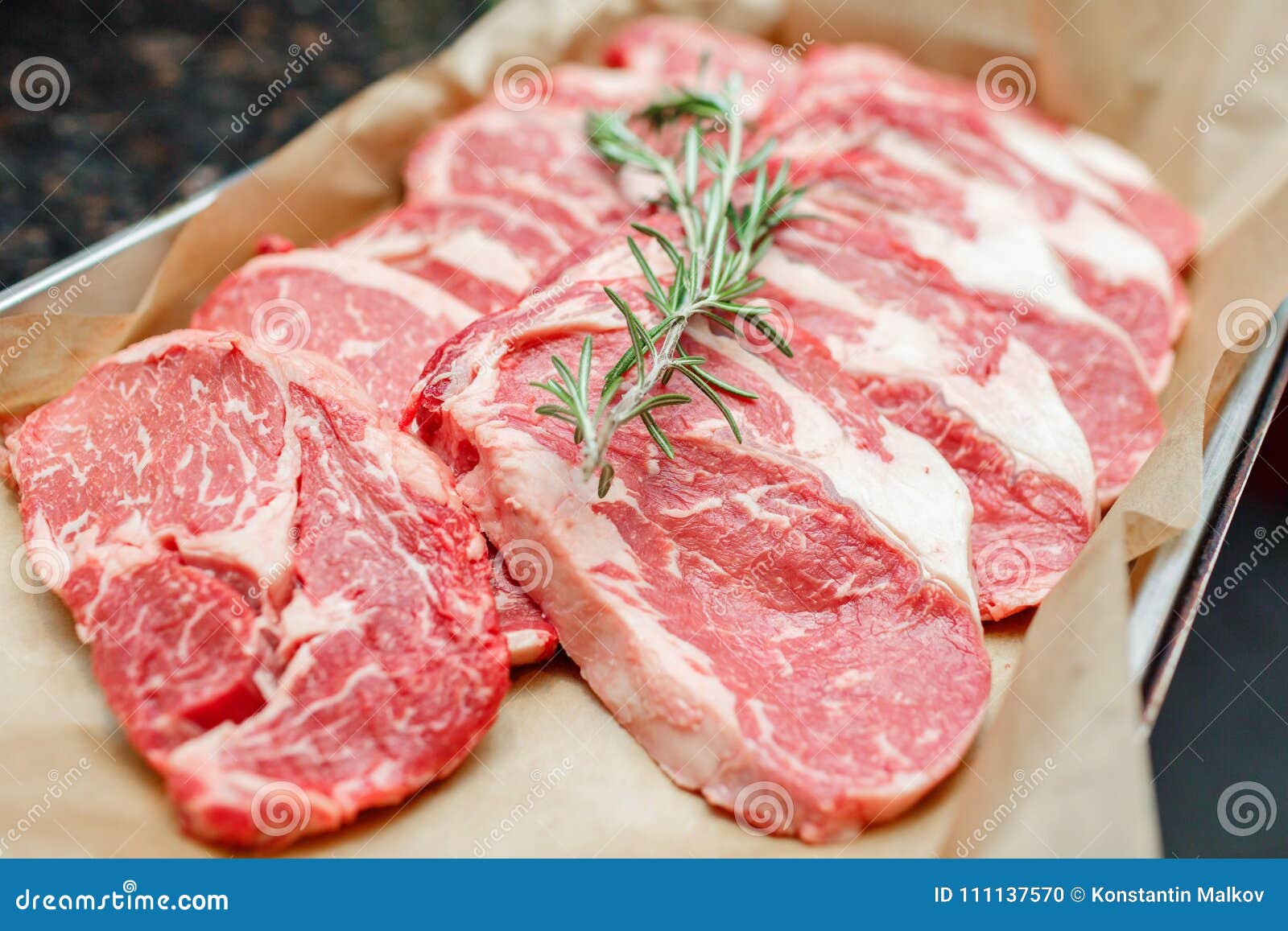 Fresh Raw Meat on Metal Plate on Dark Table. Selective Focus. Stock ...