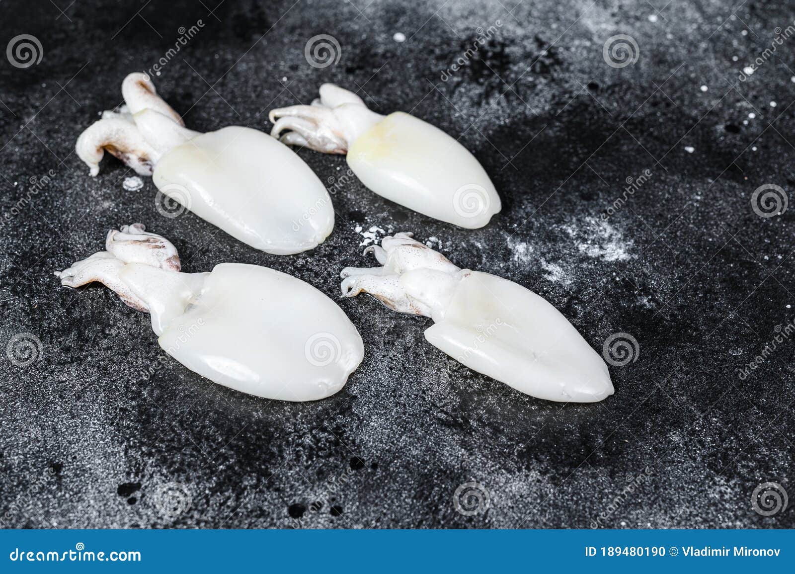 Fresh Raw Mini Cuttlefish on the Table. Black Background. Top View ...
