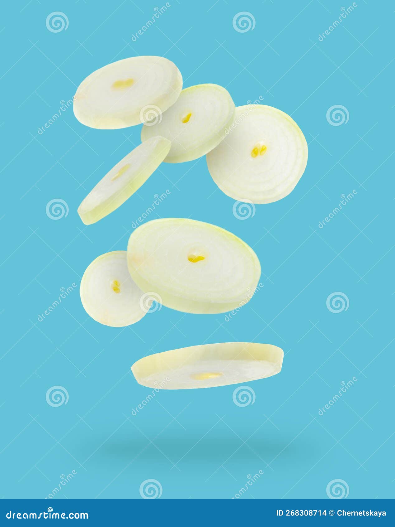 Fresh Raw Onion Slices Falling on Light Blue Background Stock Photo ...