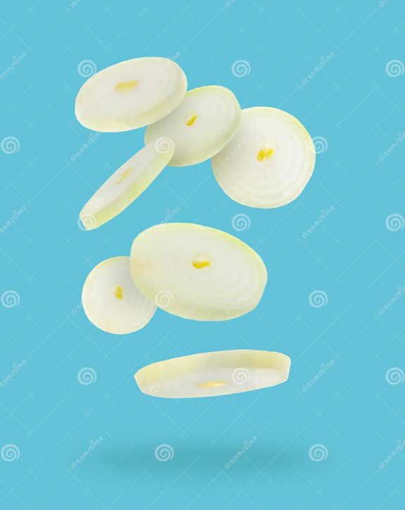 Fresh Raw Onion Slices Falling on Light Blue Background Stock Photo ...