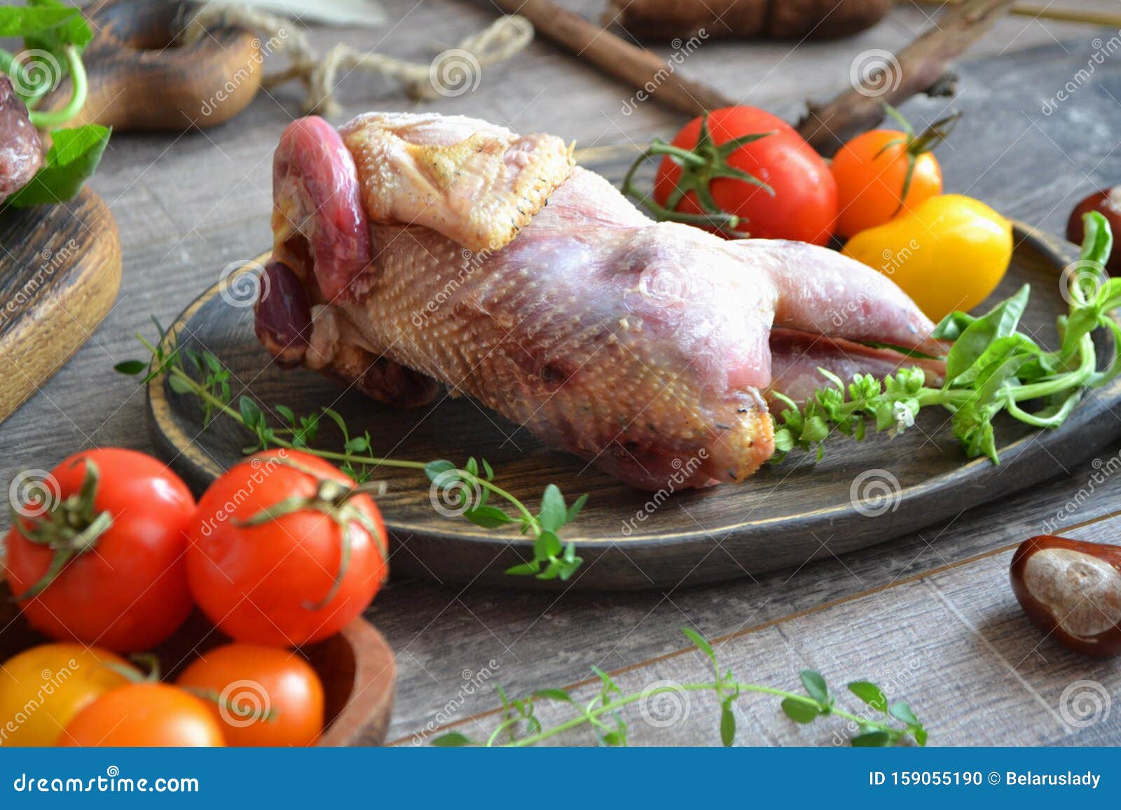 Fresh Raw Partridge on a Rustic Wooden Plate and Ingredients Stock ...