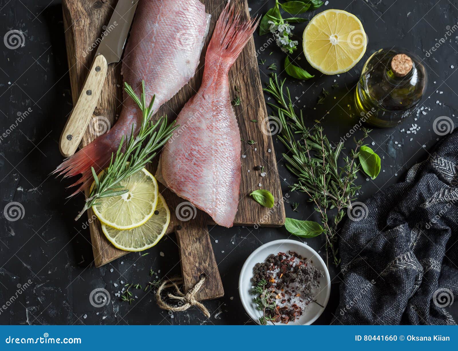 Fresh Raw Ruby Snapper, Herbs and Spices on a Dark Background. Stock ...