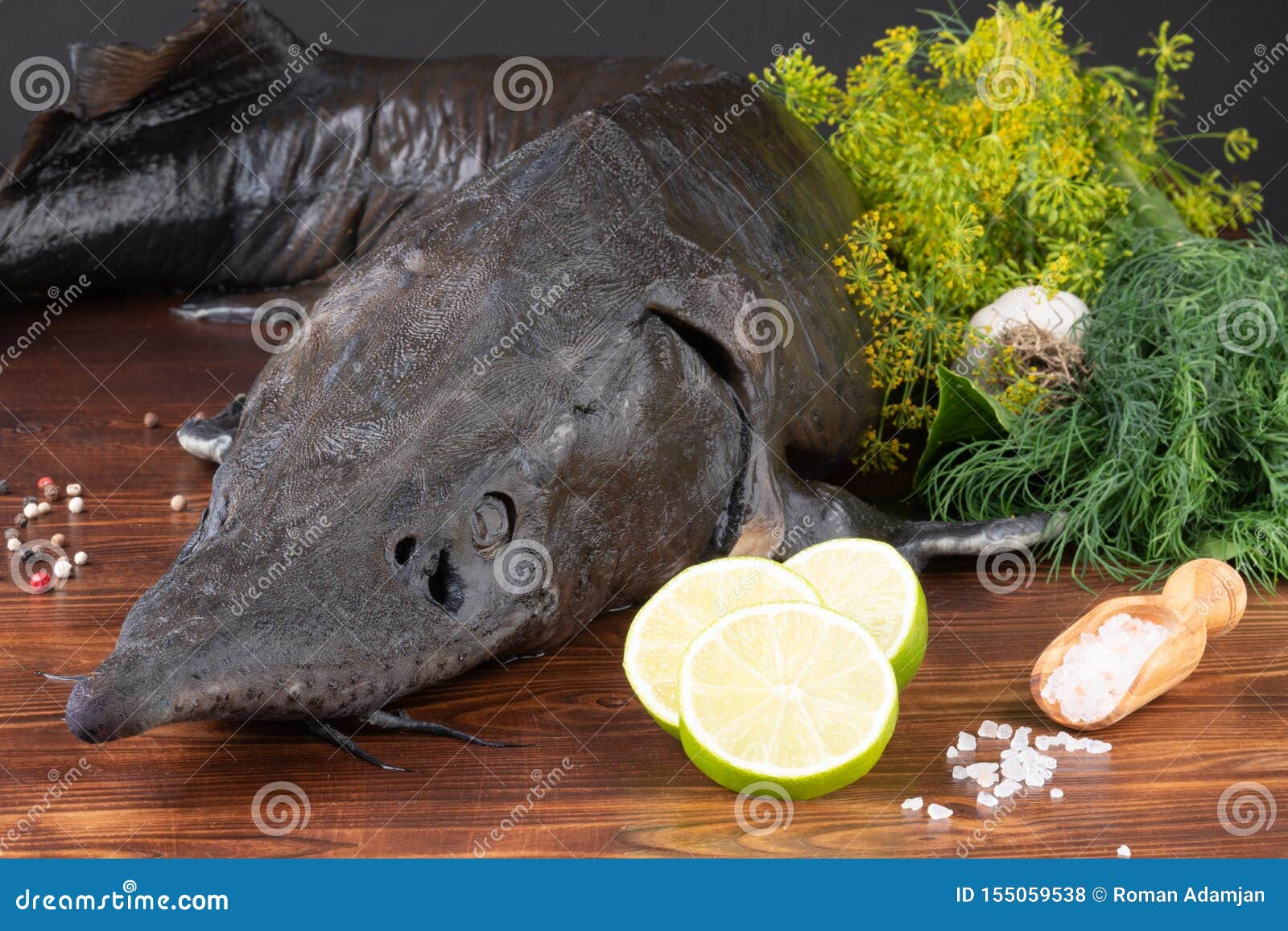 Fresh Raw Sturgeon Fish on the Table with Lemon Pepper Garlic. Clouse ...
