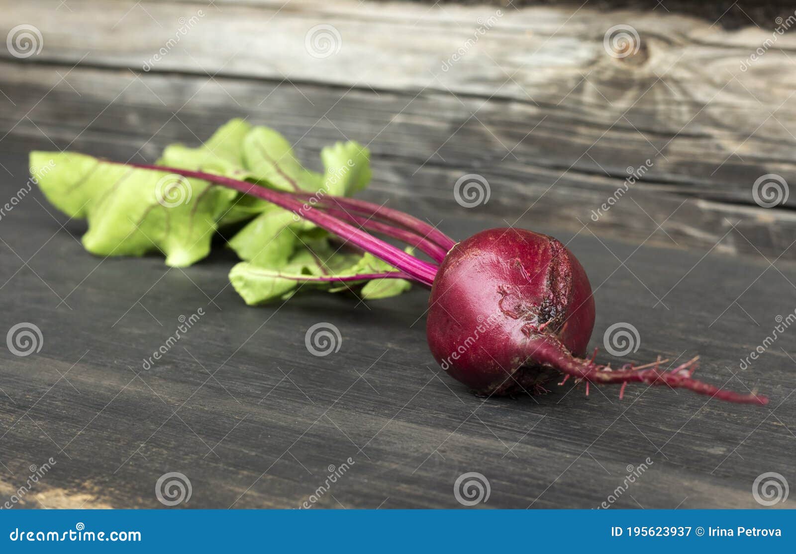 Fresh Red Beets with Leaves Lying on a Wooden Background Stock Image ...