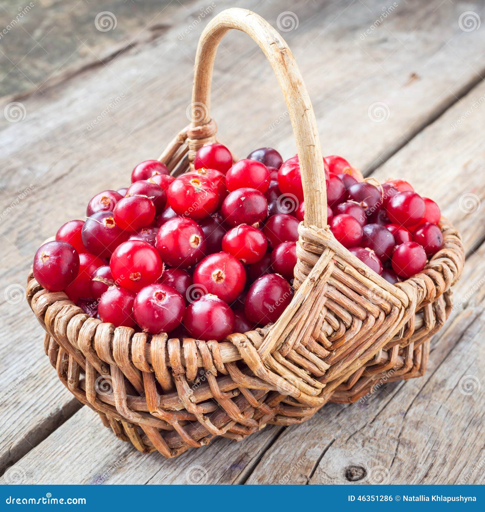 Fresh Red Cranberries in Wicker Basket on Rustic Table Stock Photo ...