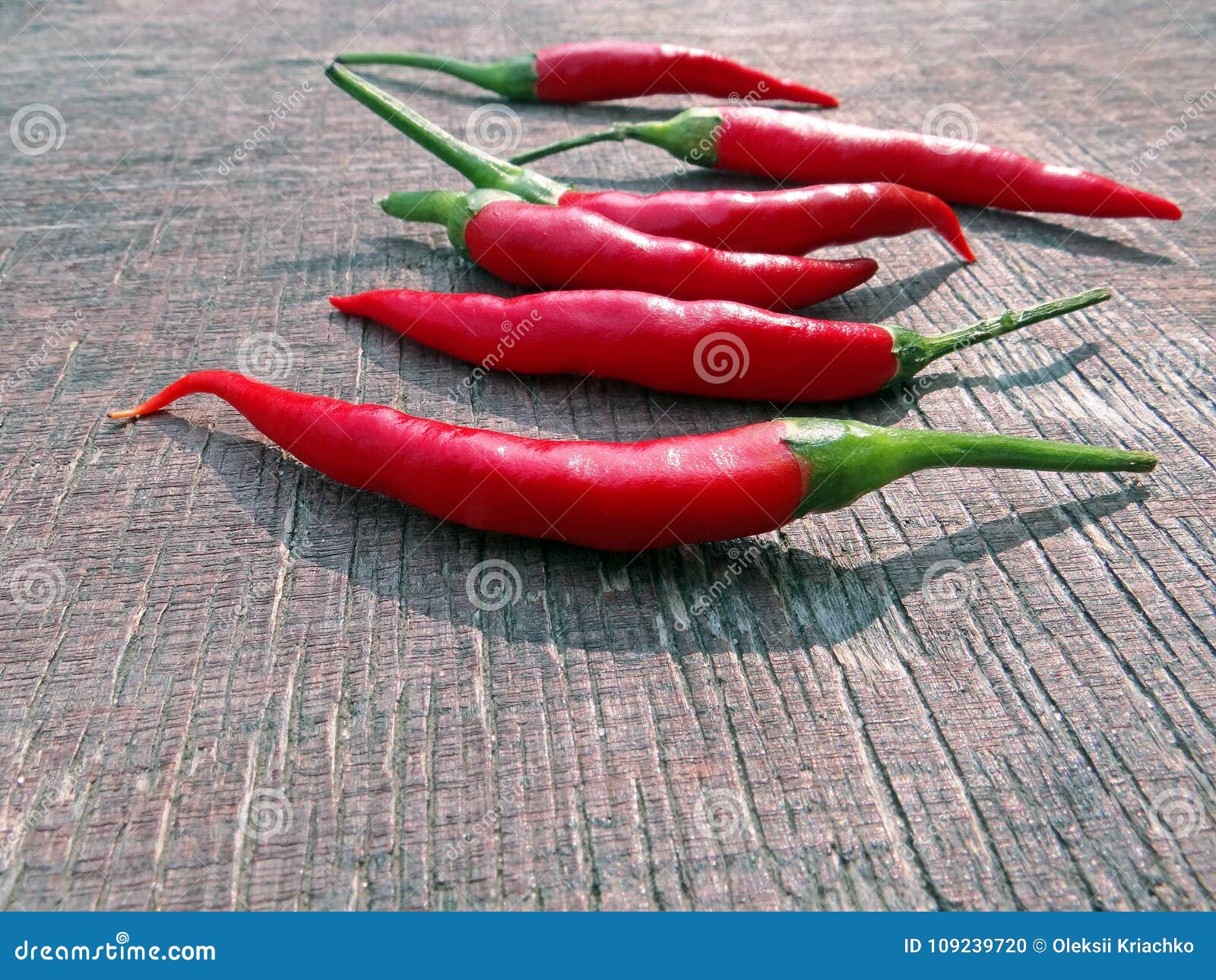 Fresh Red Hot Chili Peppers on the Rustic Wood Kitchen Table Stock ...