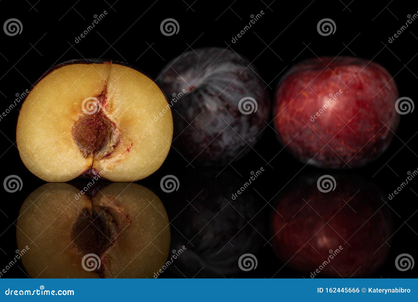 Fresh Red Plum Isolated on Black Glass Stock Photo - Image of food ...