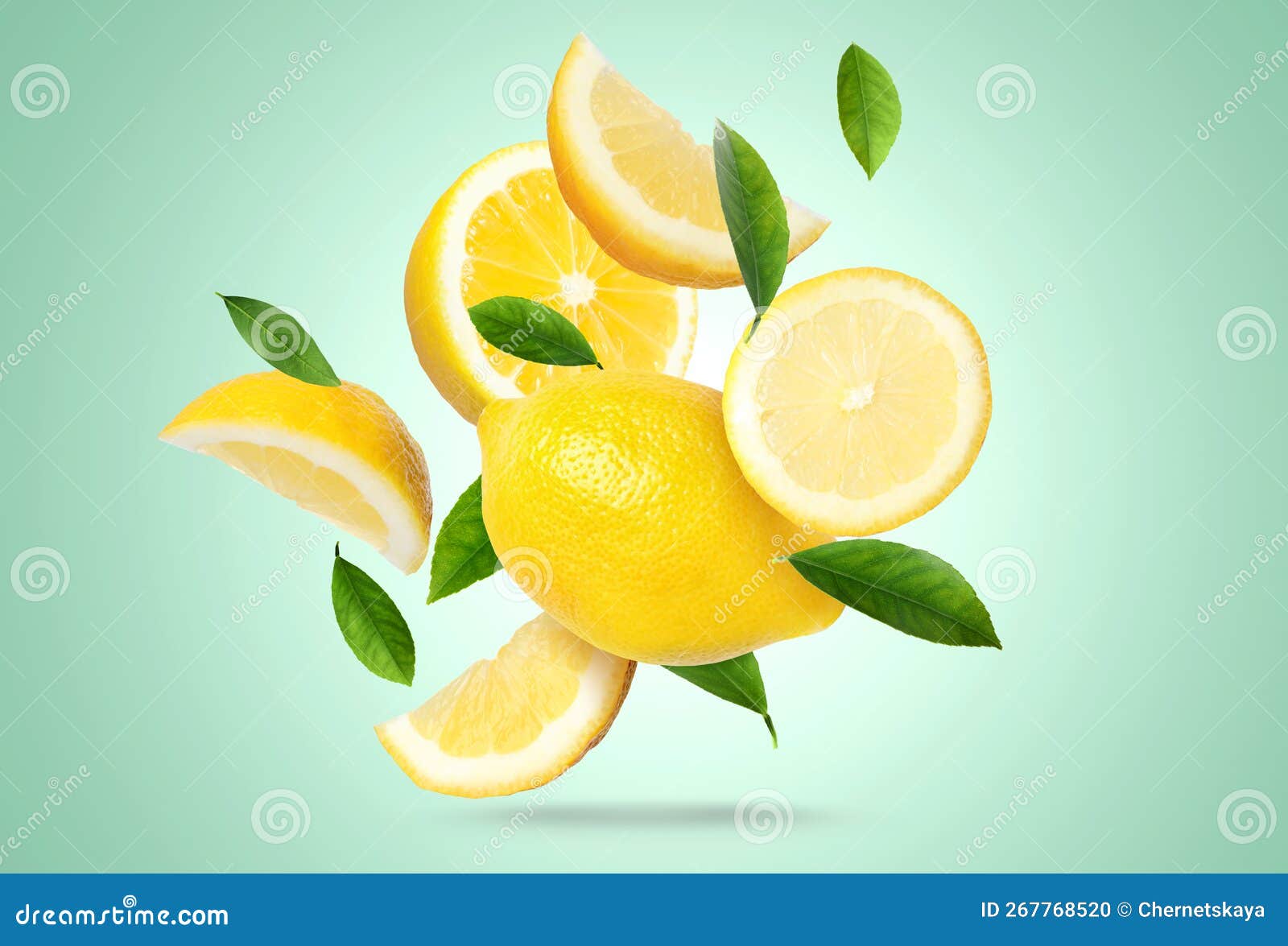 Fresh Ripe Lemons and Green Leaves Falling on Light Turquoise ...