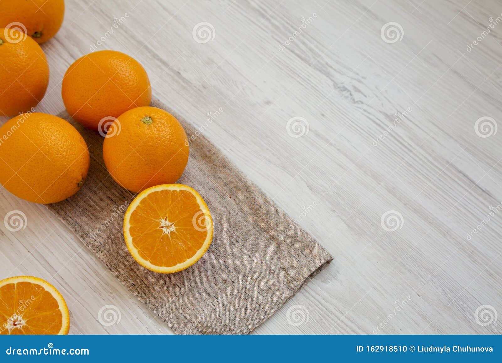 Fresh Ripe Organic Oranges on a White Wooden Surface, Low Angle View ...