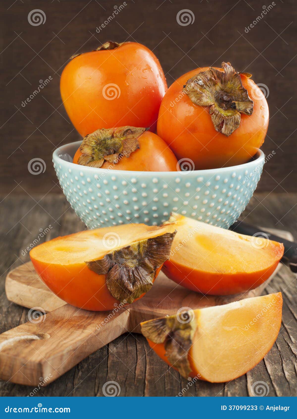Fresh Ripe Persimmons on a Wooden Table. Stock Image - Image of ripe ...