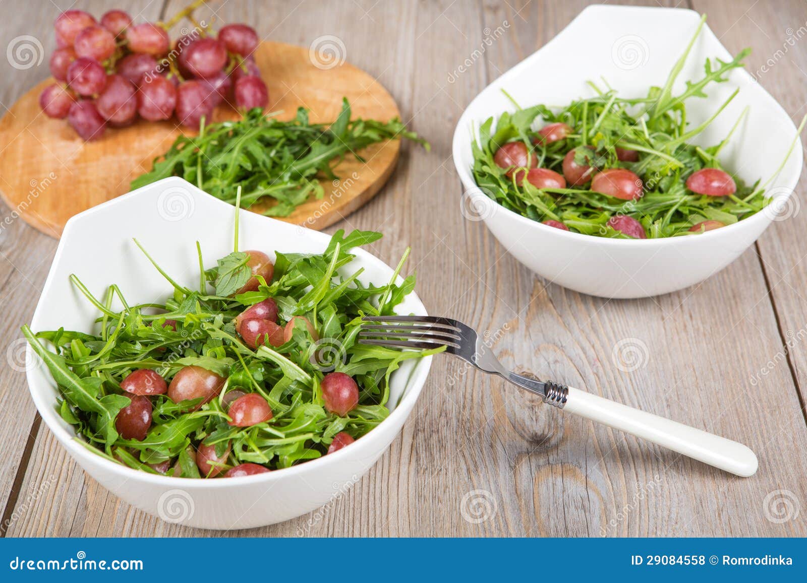 Fresh Rucola Salad with Red Grapes Stock Photo - Image of closeup ...